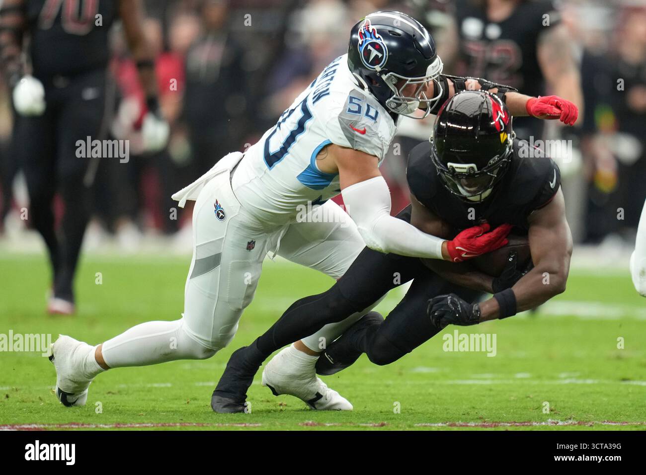Tennessee Titans linebacker Cody Barton (50) tackles Arizona Cardinals wide receiver Marvin ...