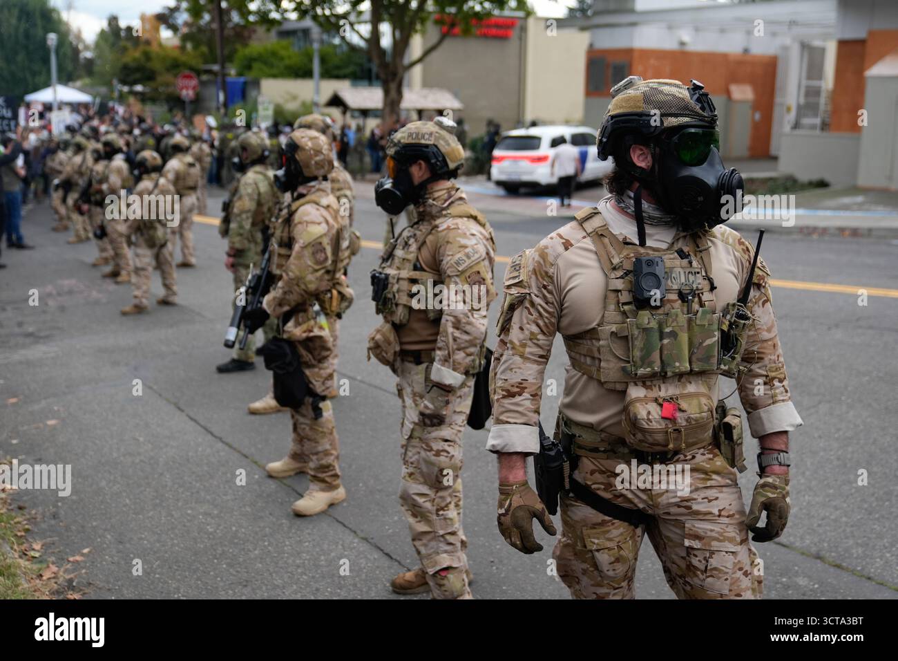 Law enforcement officers block the road for a vehicle to enter a U.S ...