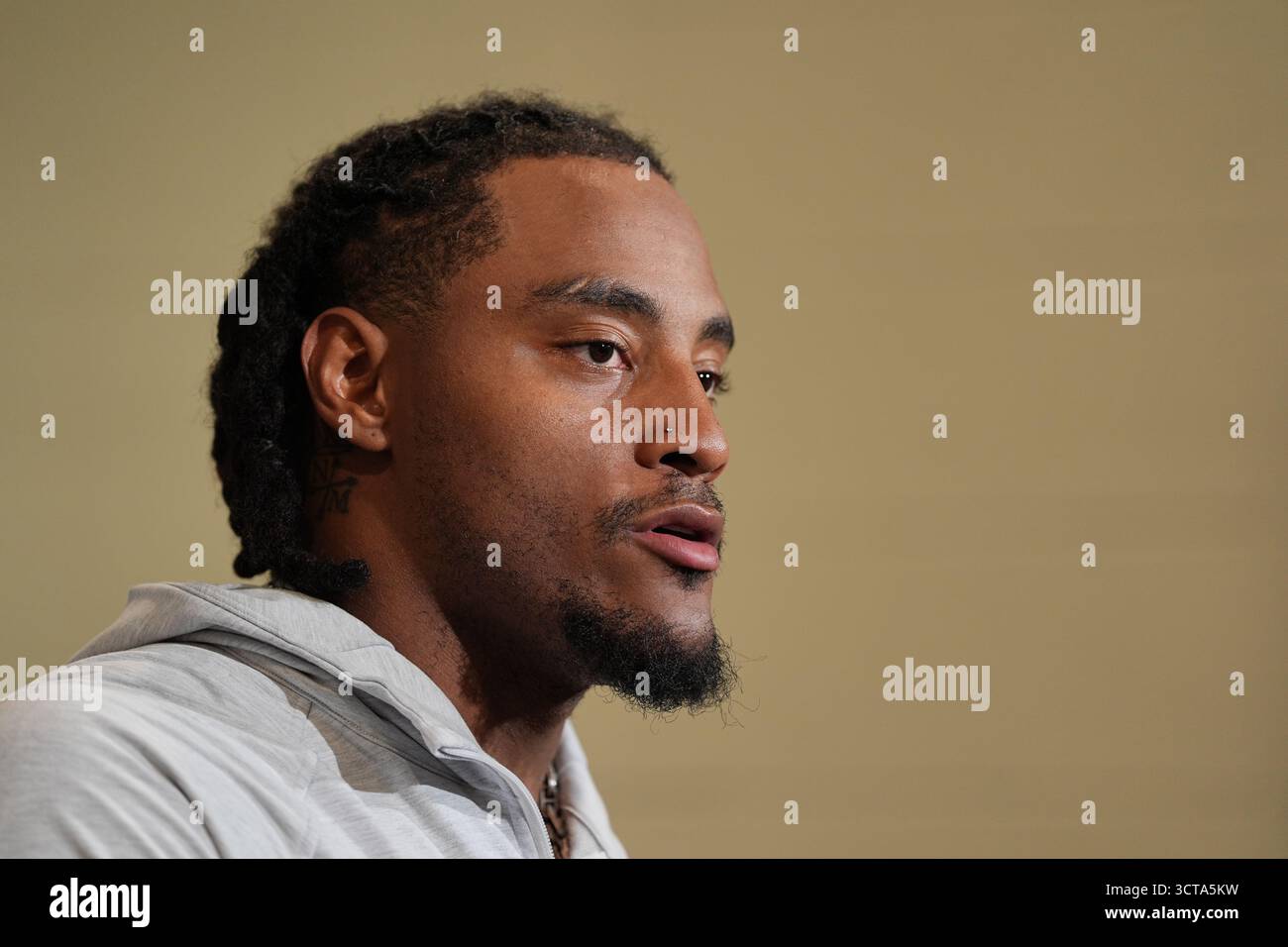 Denver Broncos linebacker Nik Bonitto speaks during a news conference after an NFL football game ...