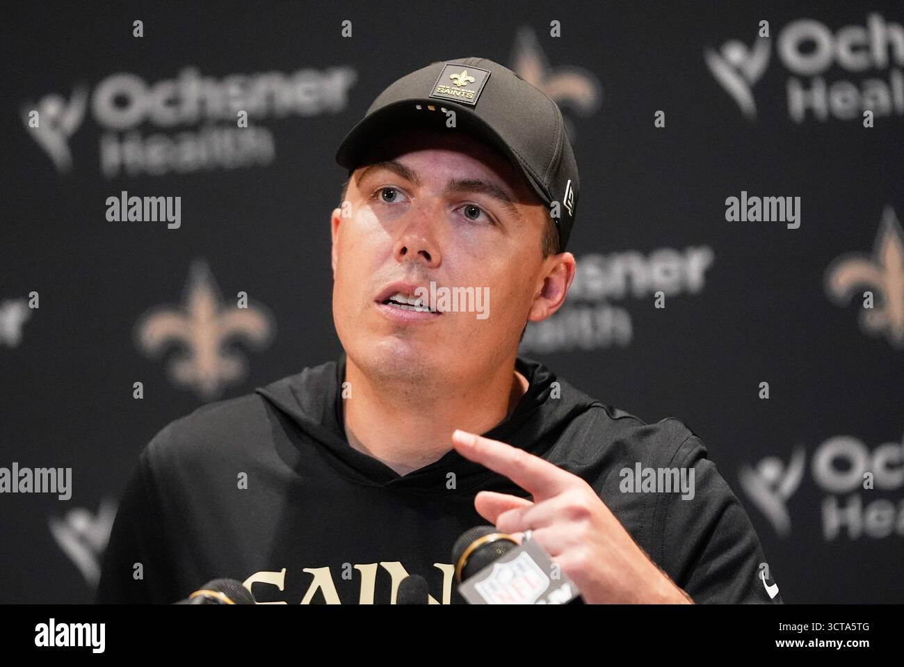 New Orleans Saints head coach Kellen Moore talks to reporters after an ...