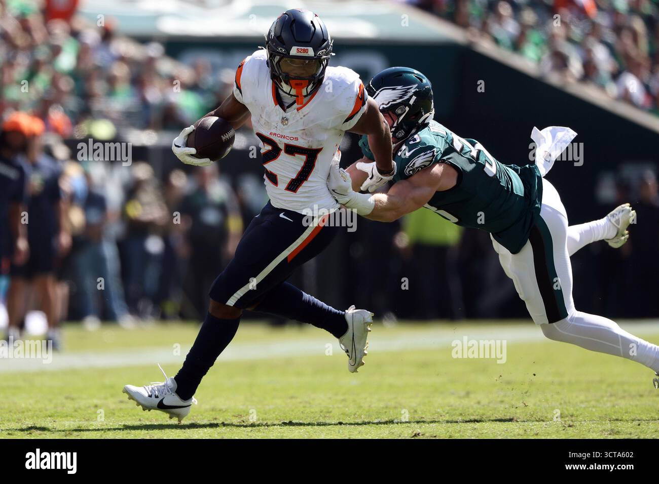 Denver Broncos running back J.K. Dobbins (27) runs with the ball during an NFL football game ...