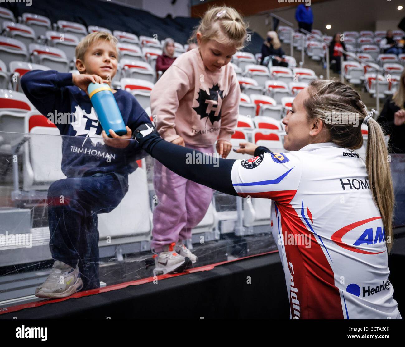 Team Homan skip Rachel Homan celebrates with her children after ...