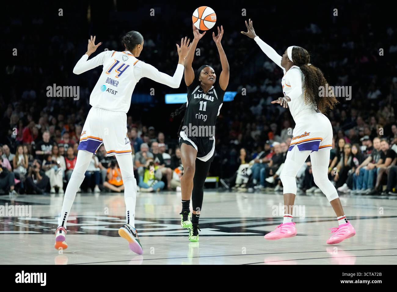 Las Vegas Aces guard Dana Evans (11) passes around Phoenix Mercury ...