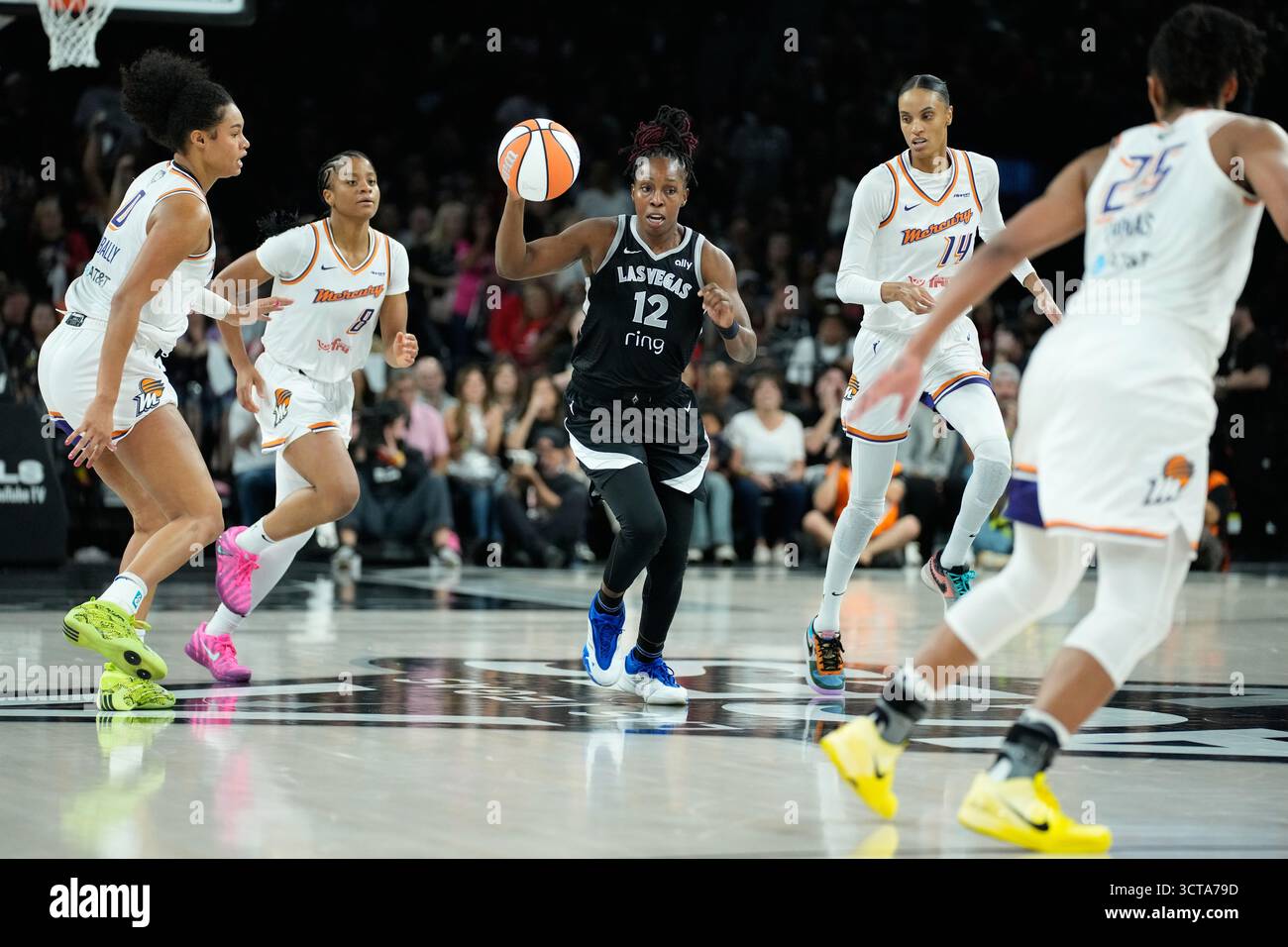 Las Vegas Aces guard Chelsea Gray (12) dribbles down the court during ...