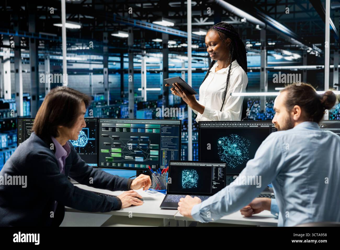 Teamworking server room colleagues hi-res stock photography and images ...