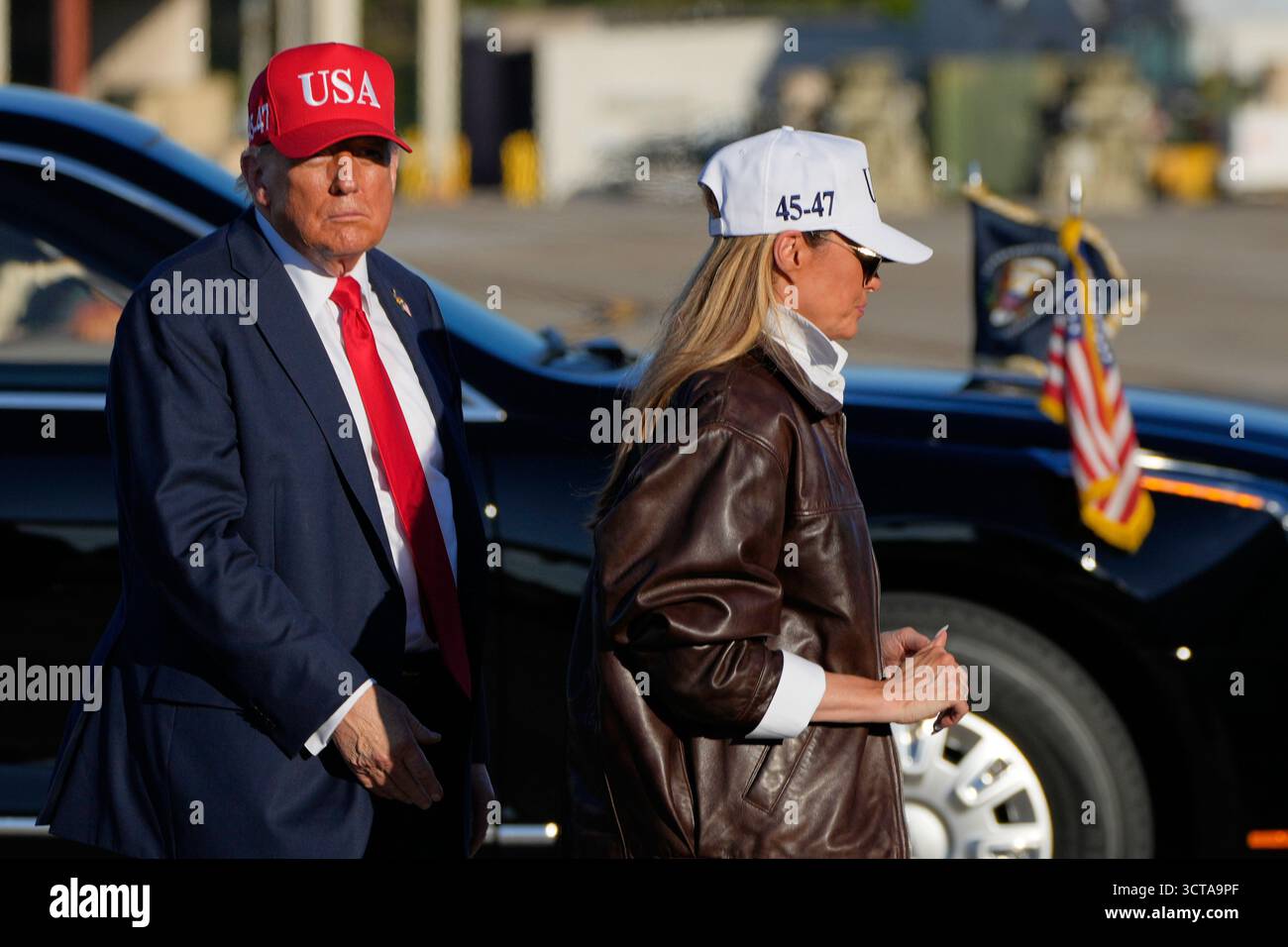 President Donald Trump and first lady Melania Trump walk to depart on ...