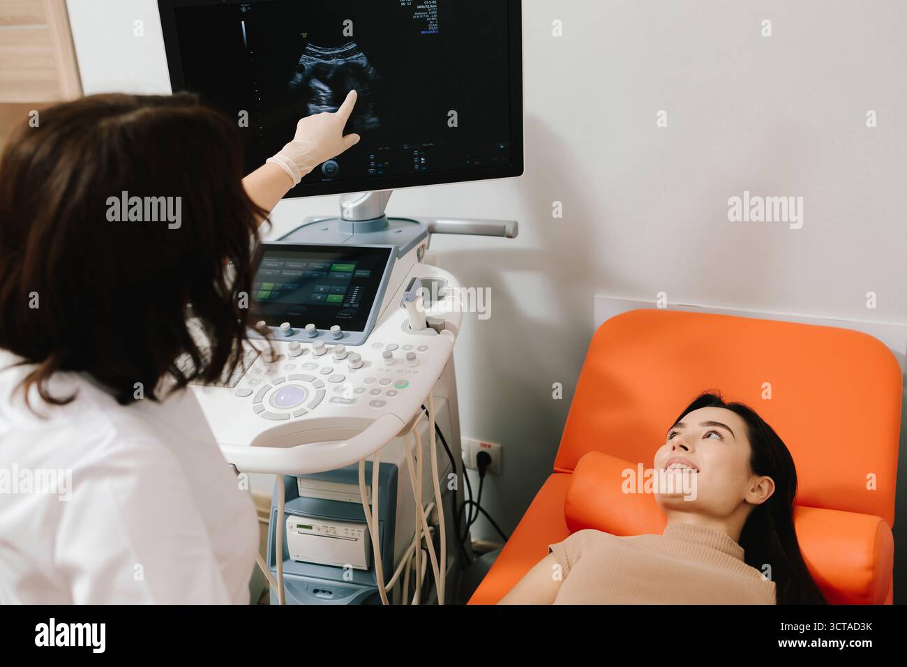 Ultrasound machine shows detailed internal imaging on screen. The ...