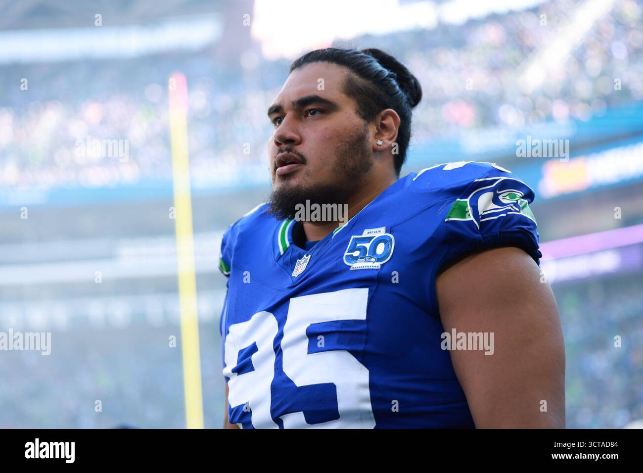 Seattle Seahawks defensive tackle Brandon Pili (95) walks on the field ...