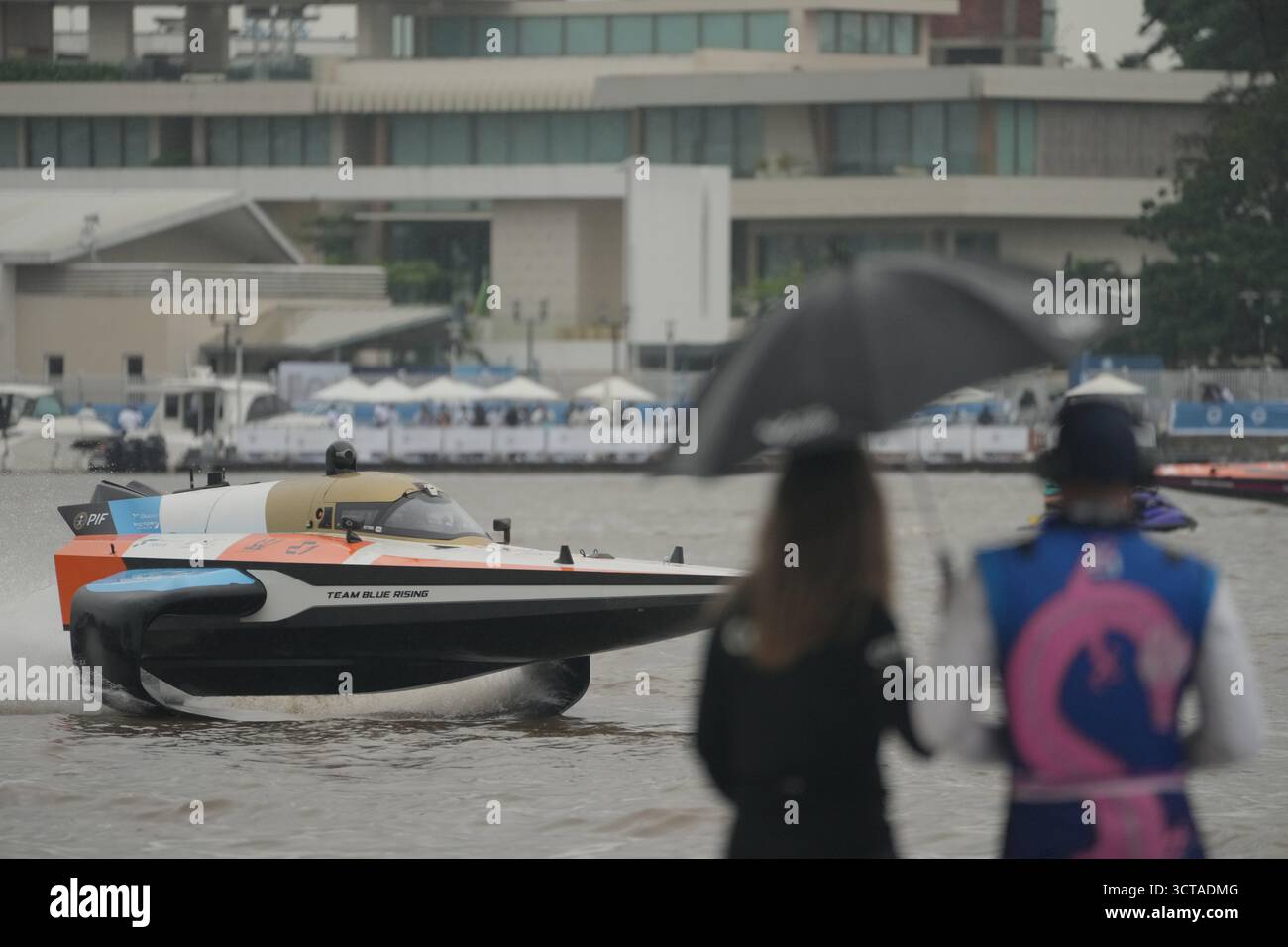 People watch as team Blue Rising, competes during the E1 powerboat ...