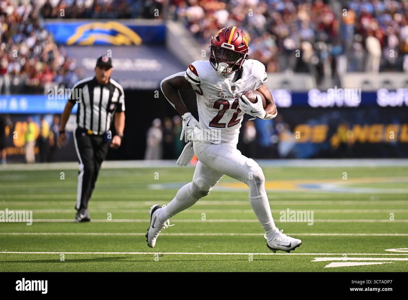Washington Commanders running back Jacory Croskey-Merritt (22) scores a ...