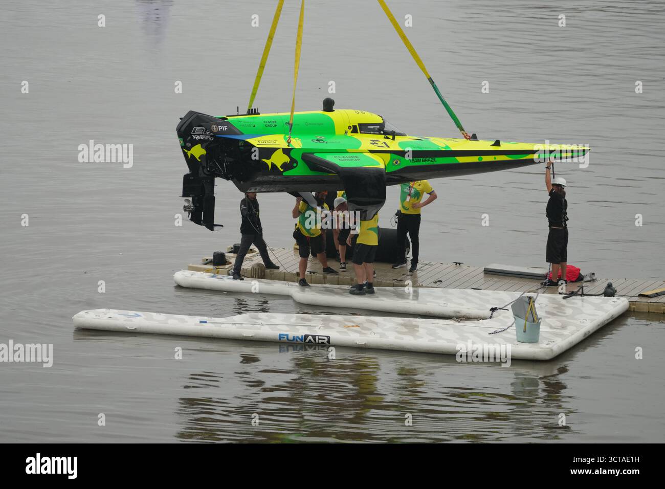 Workers launch a Team Brazil E1 powerboat before the Grand Prix ...