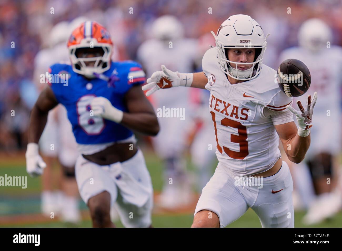 Texas wide receiver Parker Livingstone, right, makes a reception in ...