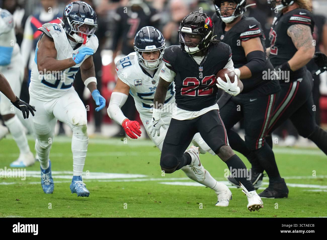 Arizona Cardinals running back Michael Carter (22) runs the ball ...