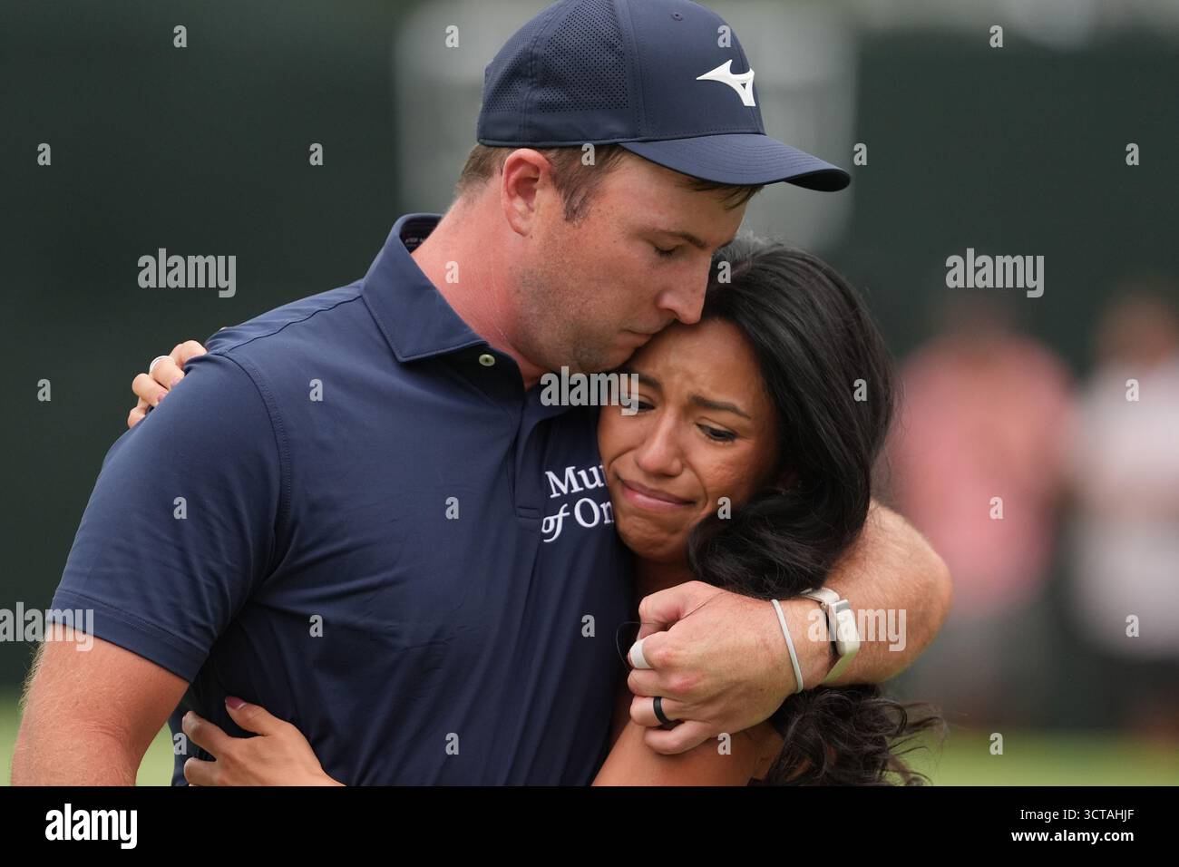 Steven Fisk, left, hugs his wife Edith Fisk, right, after winning the ...