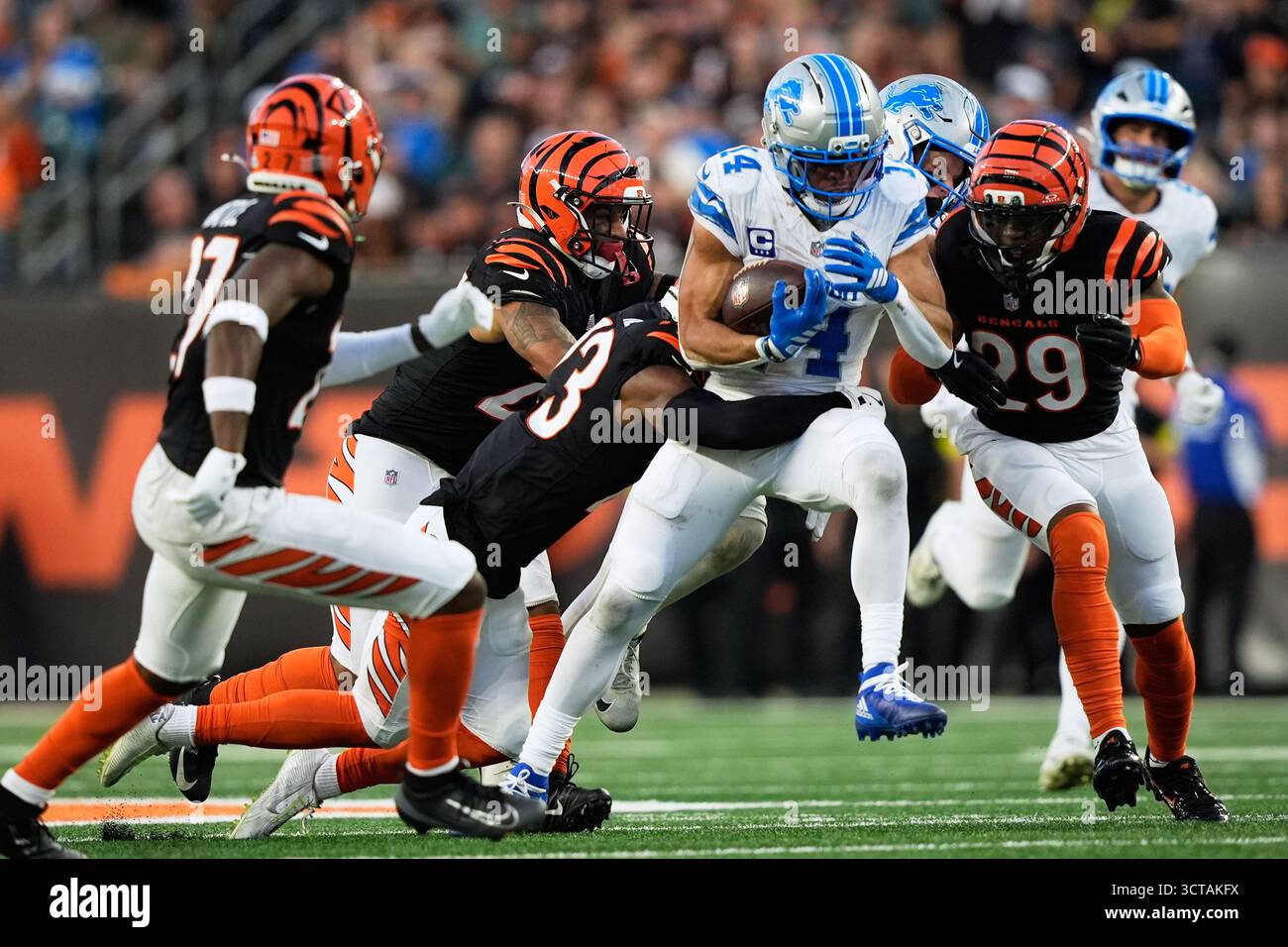 Detroit Lions wide receiver Amon-Ra St. Brown (14) is brought down by ...