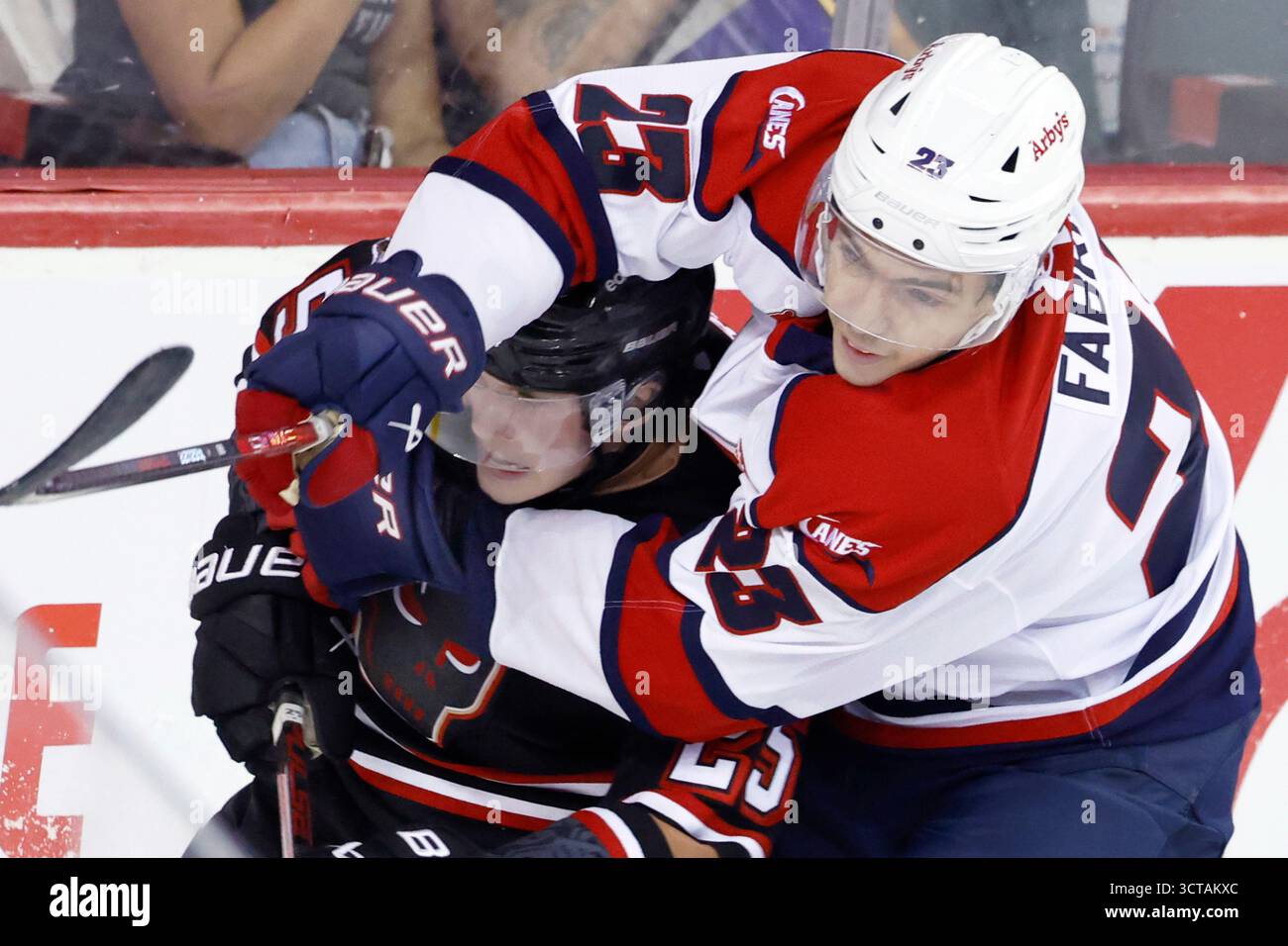 Lethbridge Hurricanes D Matteo Fabrizi, rt, grabs Calgary Hitmen LW ...