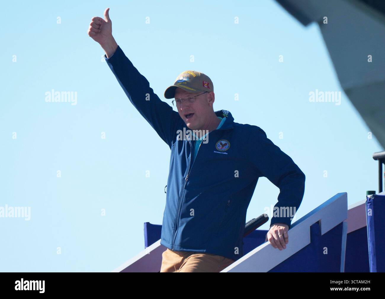 Secretary of Veterans Affairs, Douglas A. Collins walks down the ...
