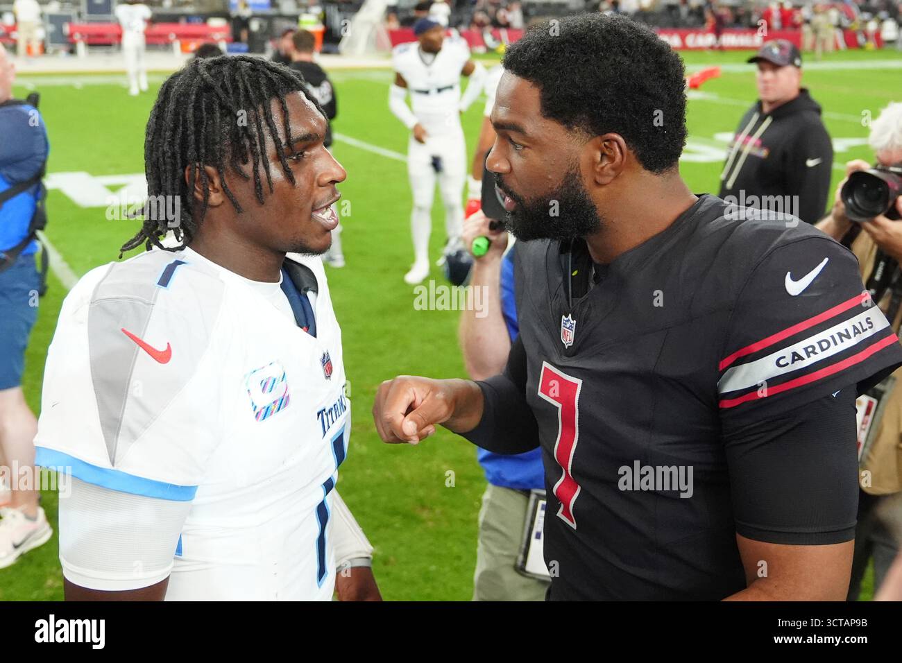Tennessee Titans quarterback Cam Ward (1) speaks with Arizona Cardinals ...