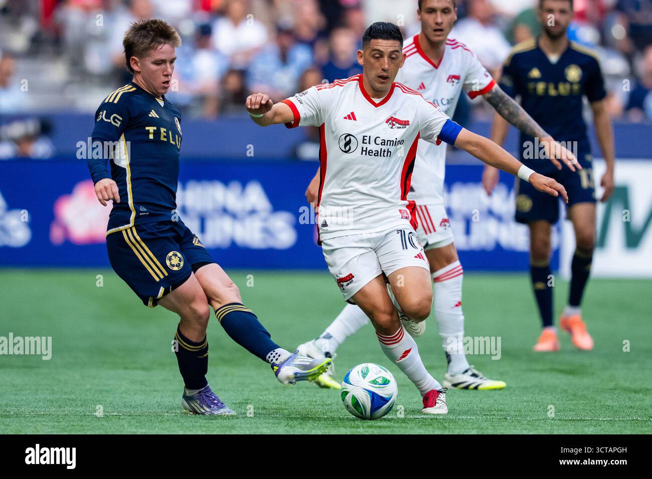 Vancouver Whitecaps' Tate Johnson, left, and San Jose Earthquakes ...