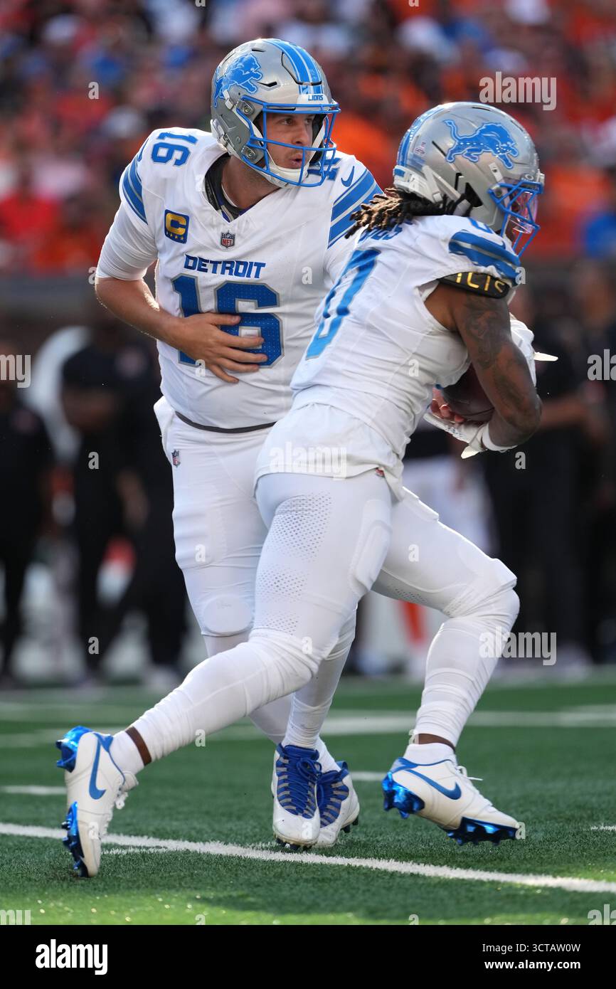 Detroit Lions quarterback Jared Goff (16) hands the ball off to running ...
