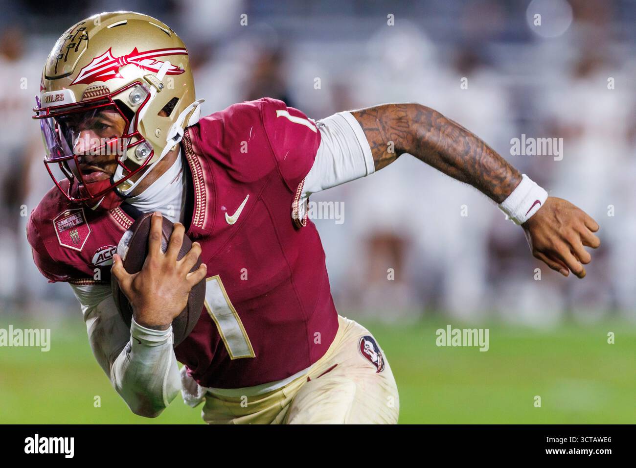 Florida State quarterback Tommy Castellanos (1) runs against Miami ...