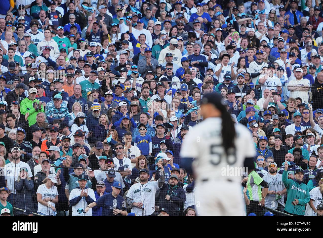 Fans watch as Seattle Mariners starting pitcher Luis Castillo waits to ...