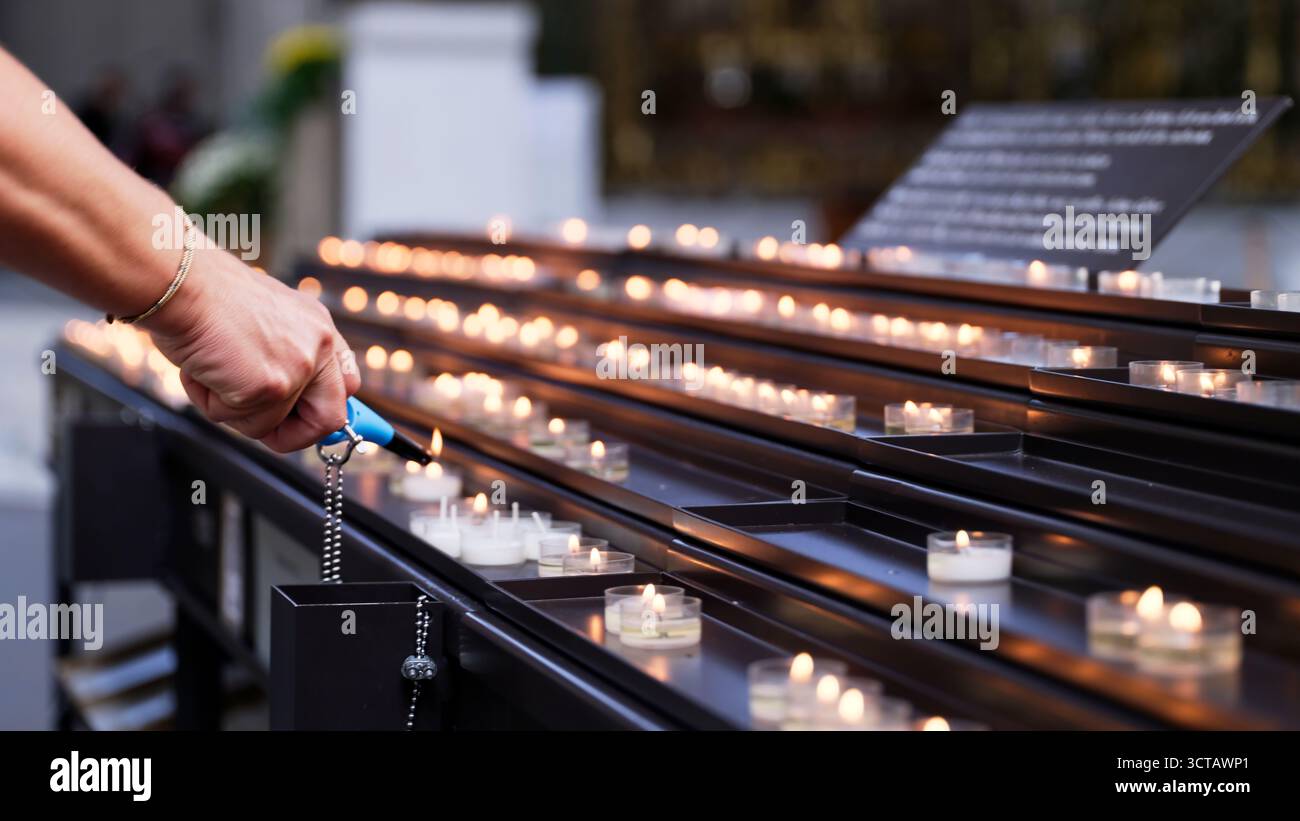 Lighting candles in a quiet memorial space for reflection and ...