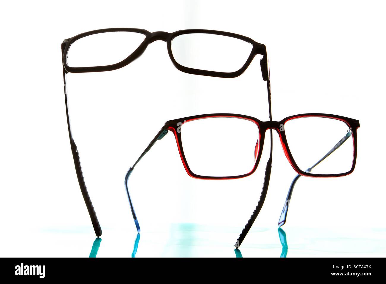 Studio photo of two eyeglasses with different frame colors isolated on ...