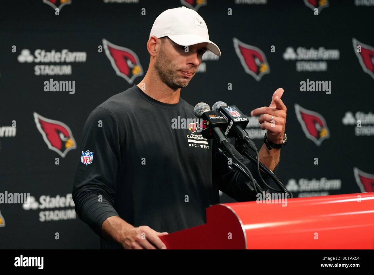 Arizona Cardinals head coach Jonathan Gannon pauses before answering a ...