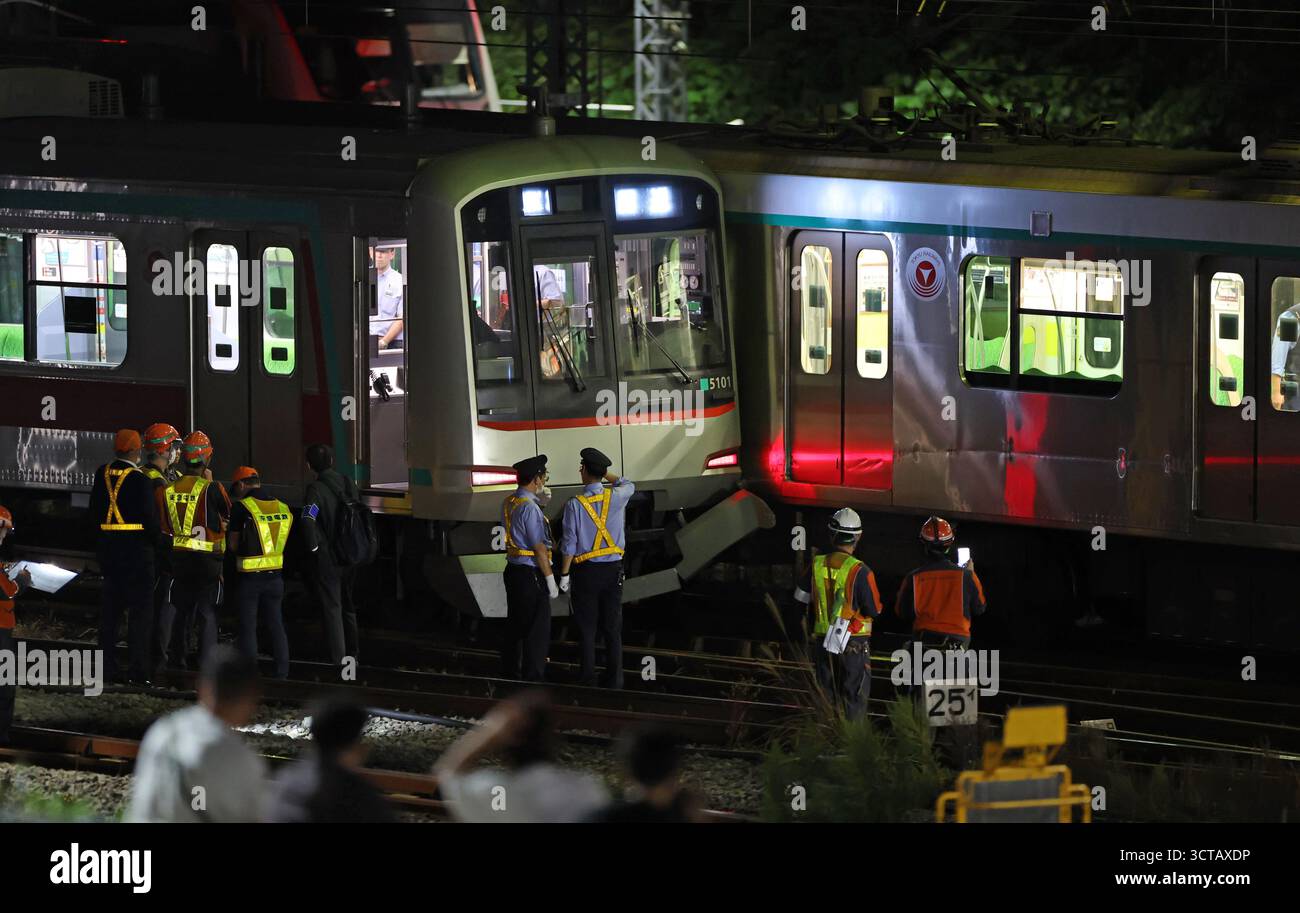 A photo shows the accident scene of the collision and derailed site at Kajigaya Station on the ...