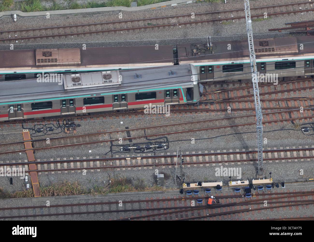An aerial photo shows the accident scene of the collision and derailed ...