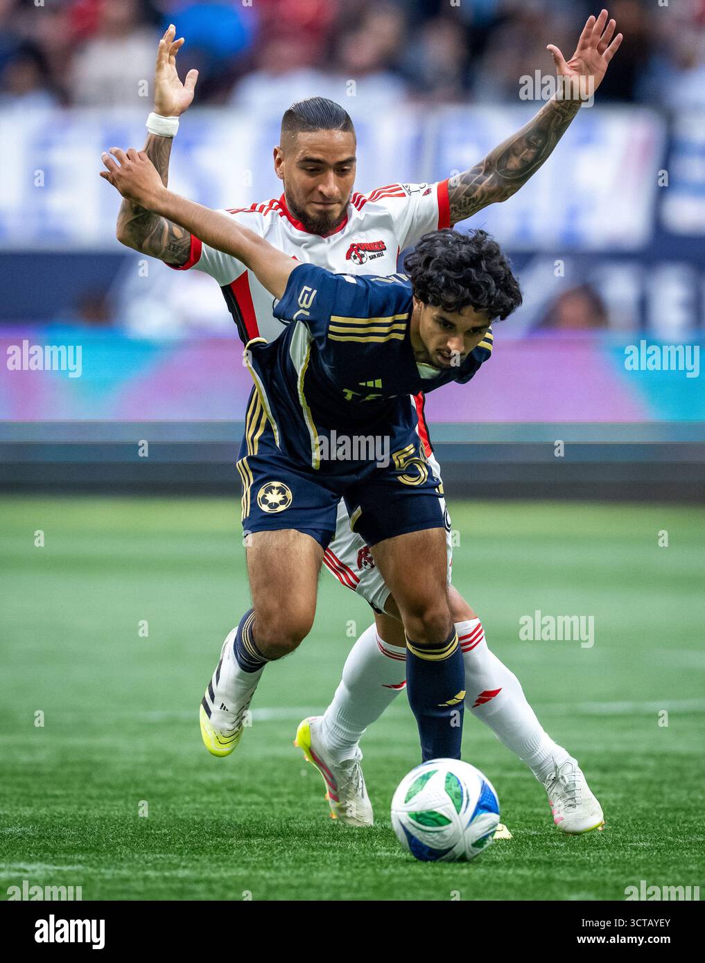 Vancouver Whitecaps' Jeevan Badwal, front, and San Jose Earthquakes ...