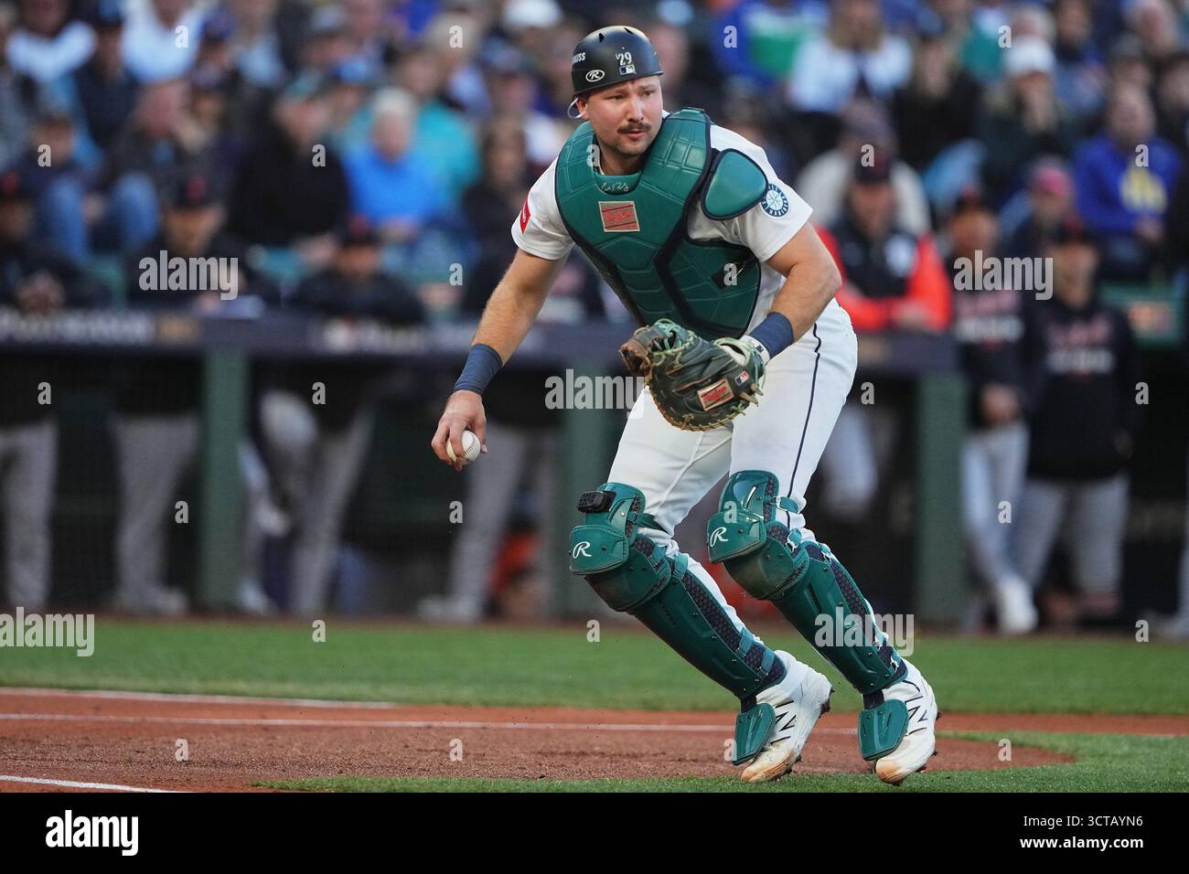 Seattle Mariners catcher Cal Raleigh prepares to throw out Detroit ...