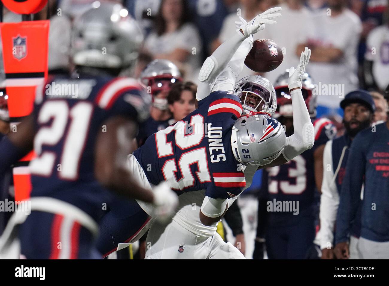 New England Patriots cornerback Marcus Jones (25) breaks up a pass ...