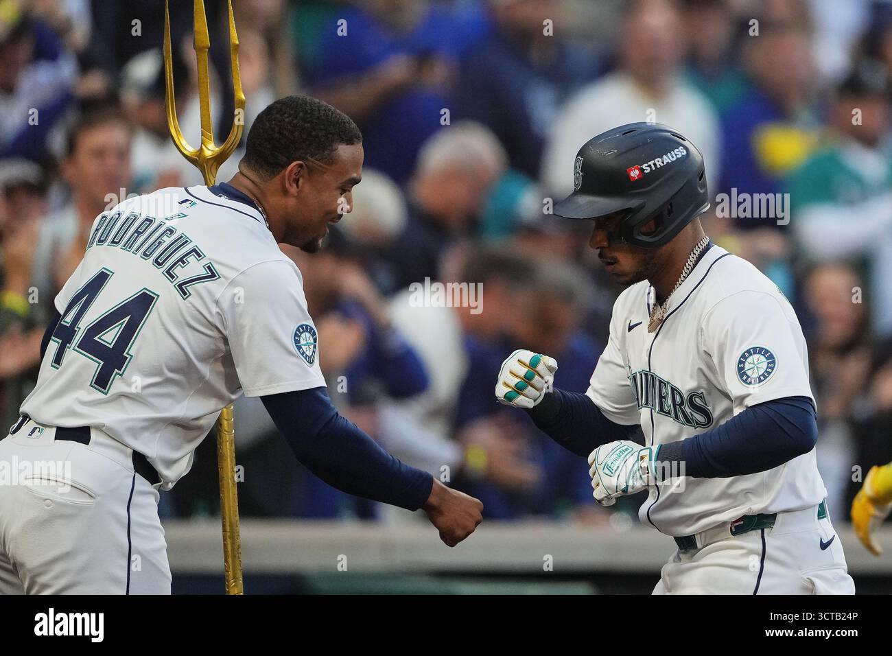 Seattle Mariners' Jorge Polanco, right, celebrates with Julio Rodriguez ...