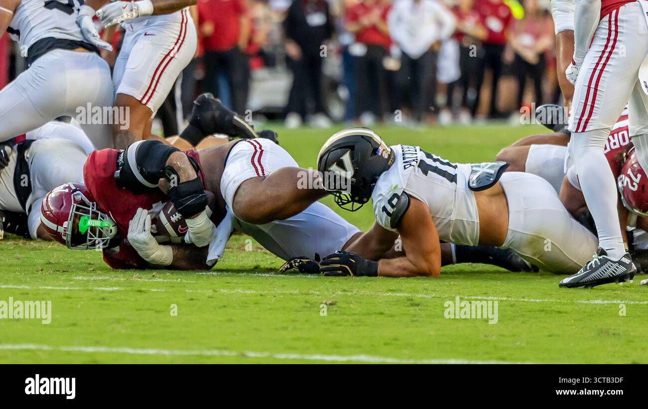 Alabama offensive lineman Kadyn Proctor (74) falls forward on a running ...