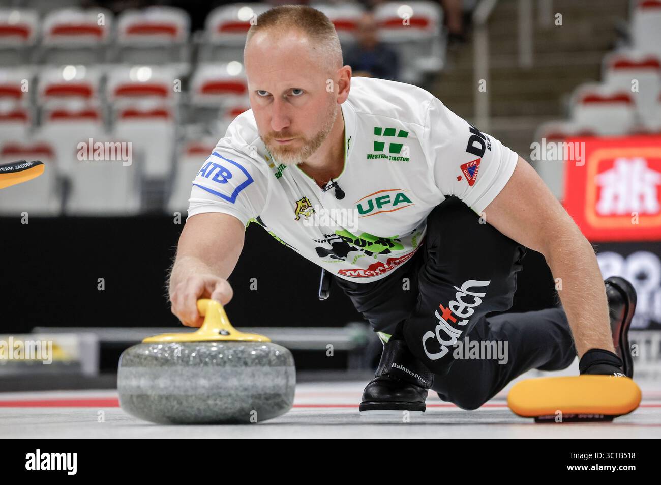 Team Jacobs skip Brad Jacobs makes a shot against Team Dunstone during ...