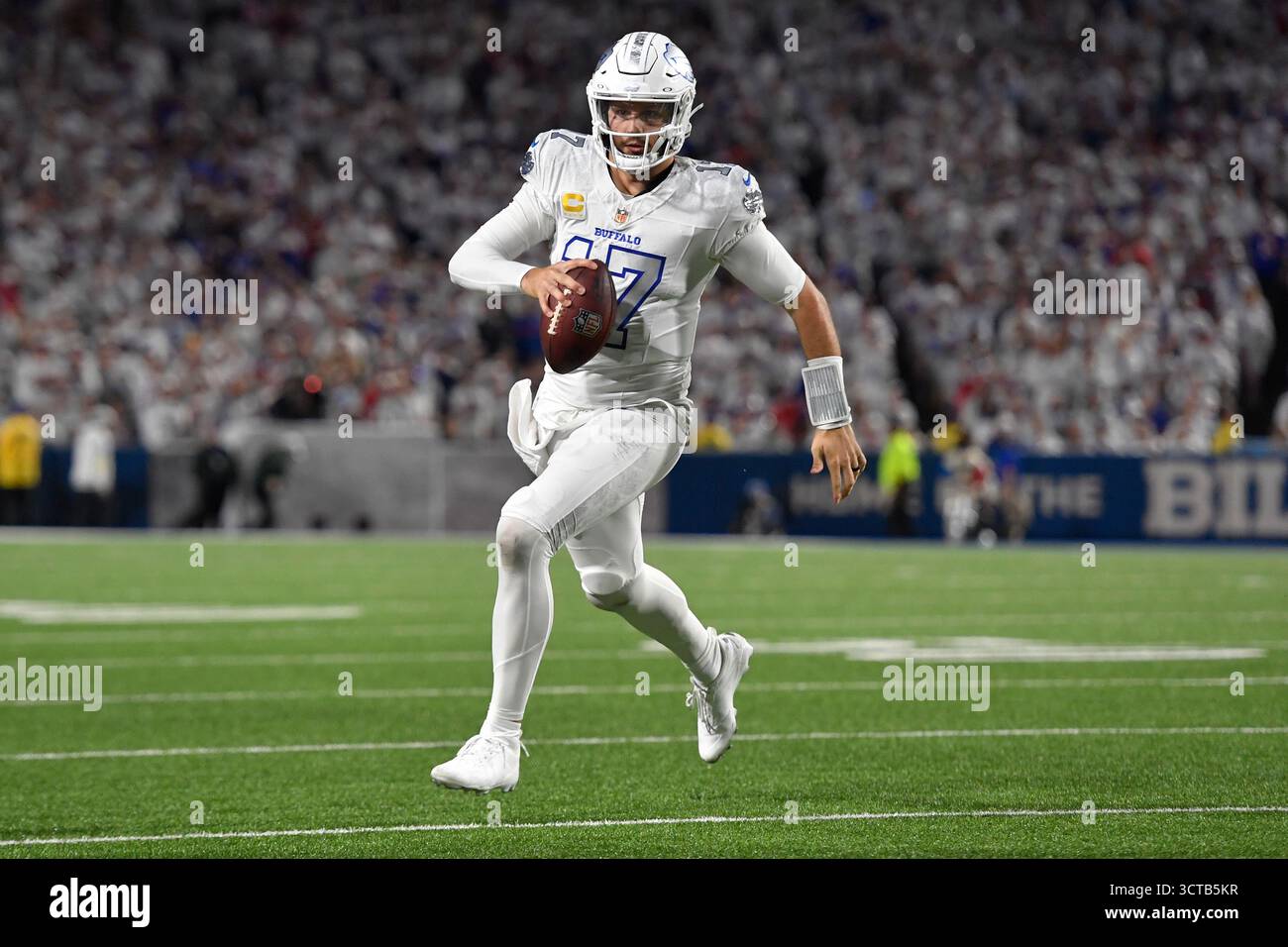 Buffalo Bills quarterback Josh Allen (17) runs for a first down against ...