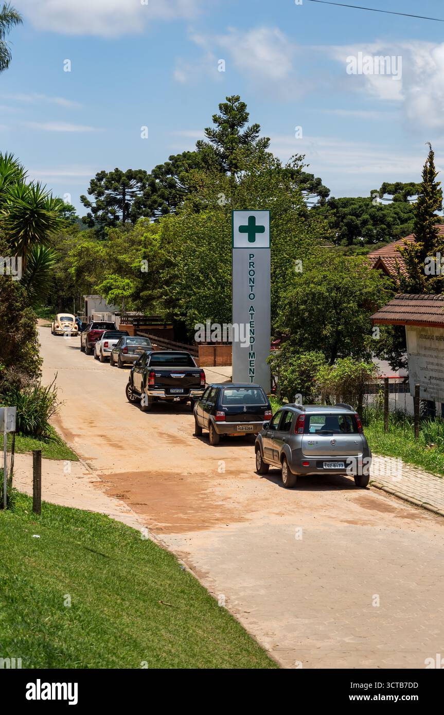 Quiet Sol Nascente avenue with parked cars, a medical emergency ...