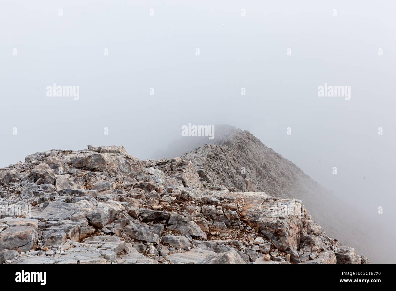 Cloudy rocky mountain peak. Harsh weather in the highlands Stock Photo ...