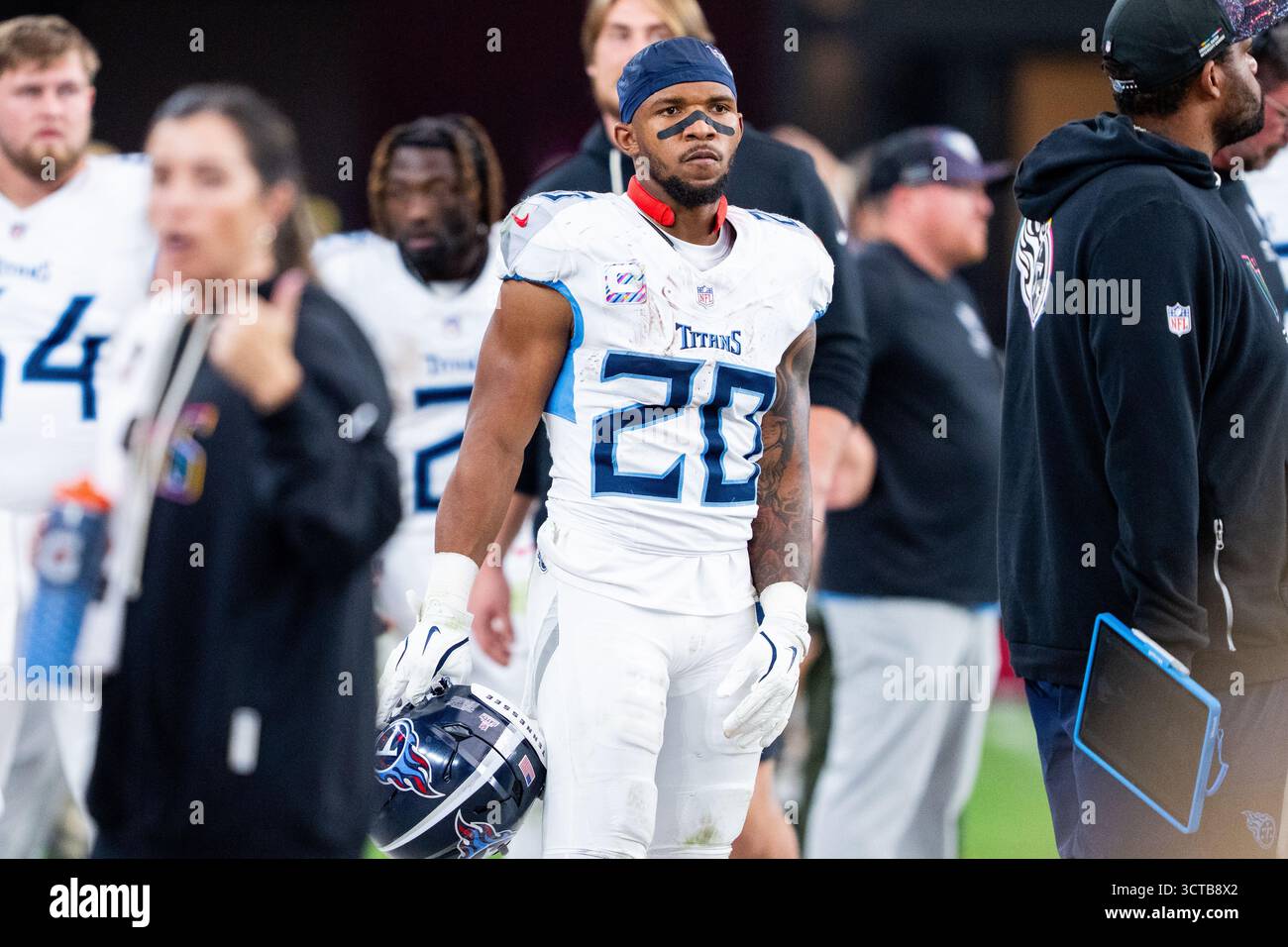 Tennessee Titans running back Tony Pollard (20) looks n with his helmet ...