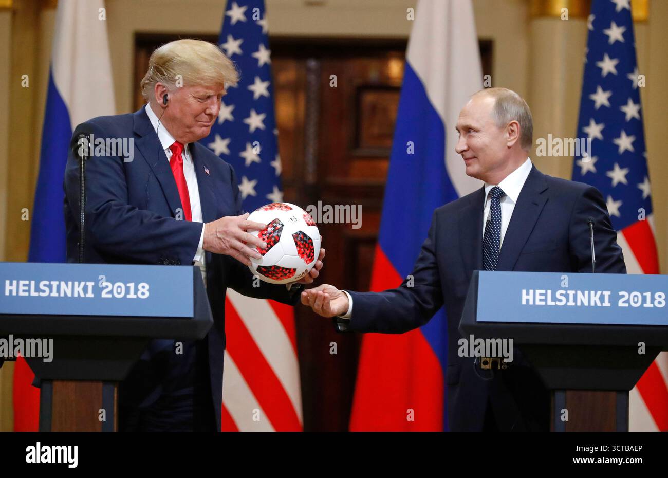 FILE - Russian President Vladimir Putin, right, gives a soccer ball to ...