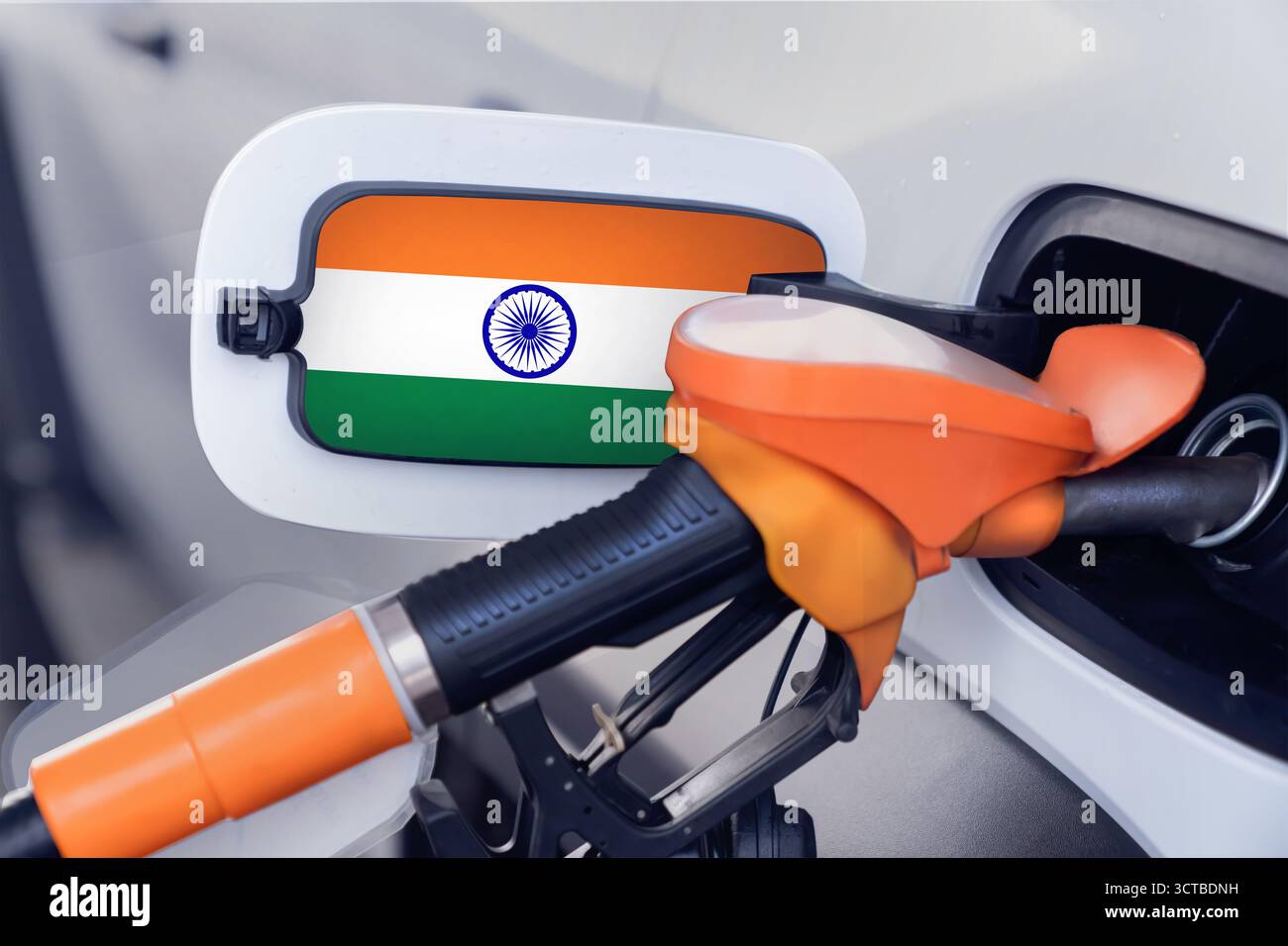 India flag on the lid of the gas tank of a car at a gas station in ...