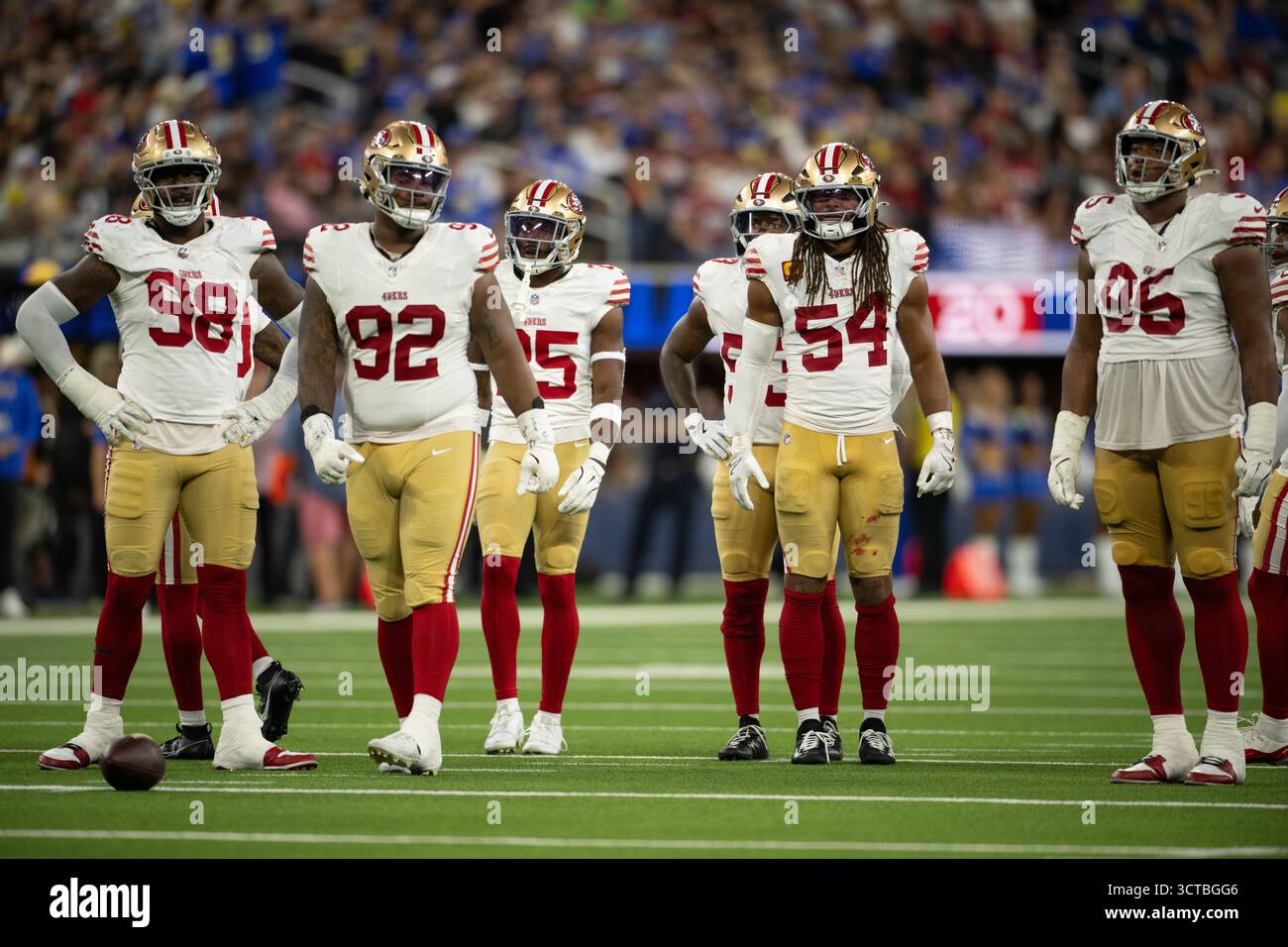 San Francisco 49ers players huddle during an NFL football game against ...