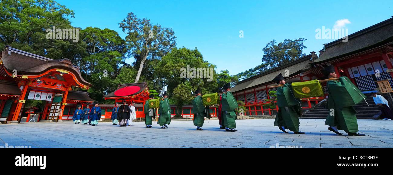 A procession of imperial envoys dressed in traditional attire walking ...
