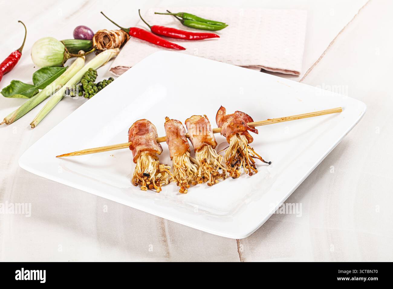 Thai Street foof satay with bacon and mushroom enoki skewer Stock Photo ...