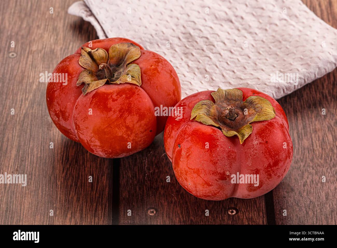 Sweet and tasty fresh ripe persimmon fruit Stock Photo - Alamy