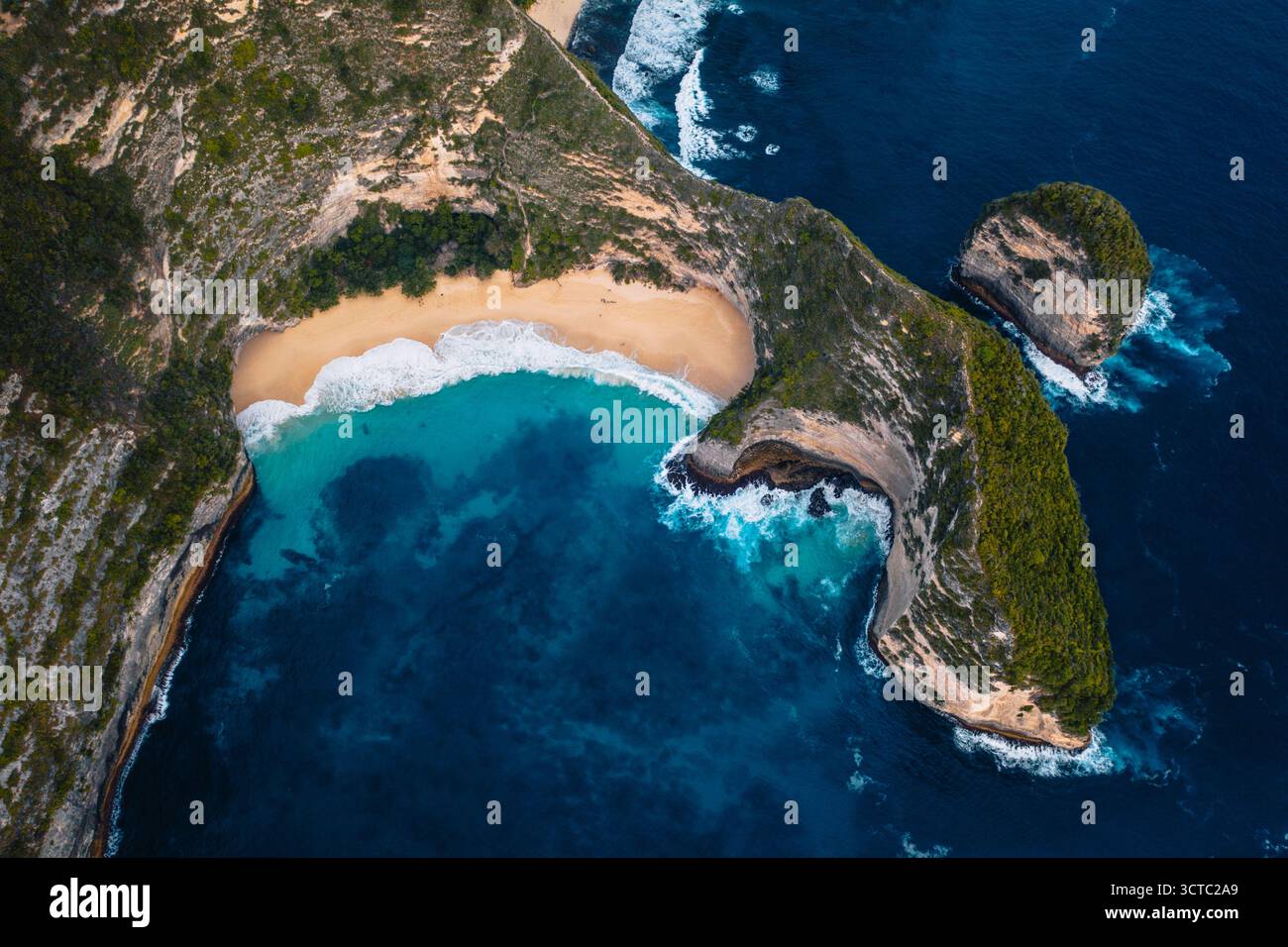 Aerial view of the iconic T-Rex shaped cliffs embracing a secluded ...