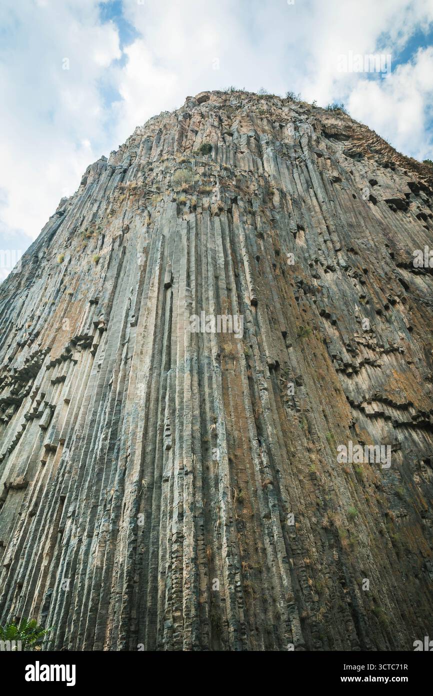 Towering basalt cliffs rise dramatically into the sky in Garni Gorge ...