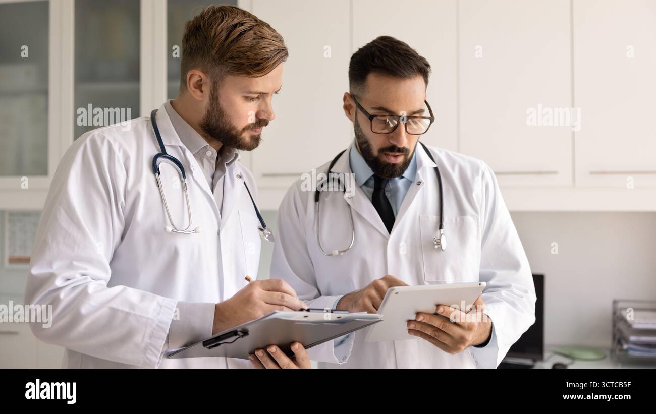 Two focused general practitioners hi-res stock photography and images ...